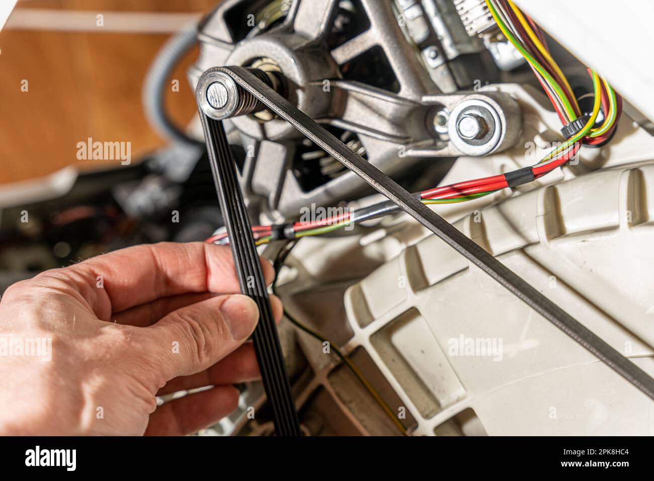 Electric motor and belt drive of an electric washing machine Stock ...