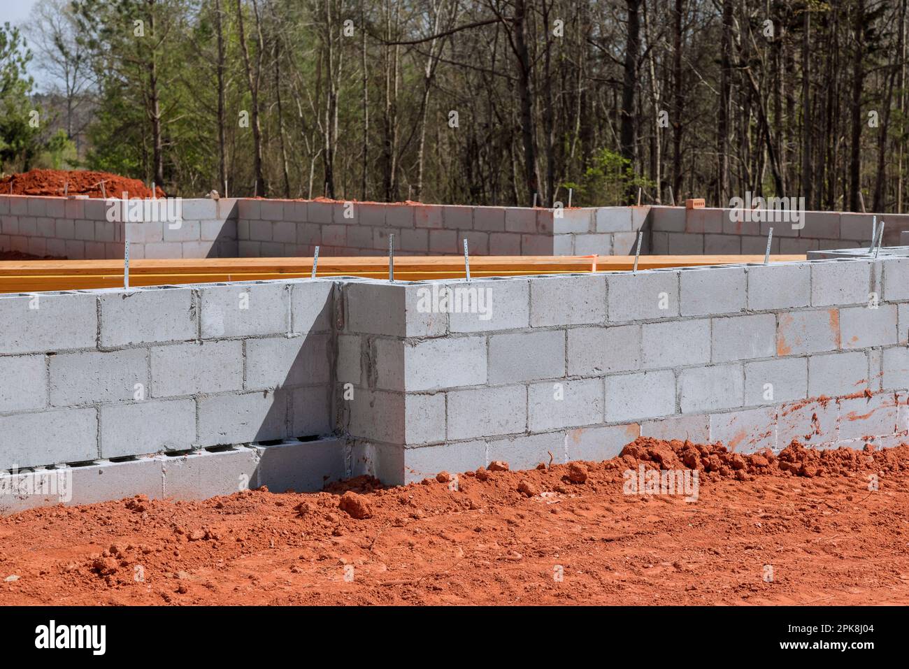 On construction site cement blocks are laid for walls that will support ...