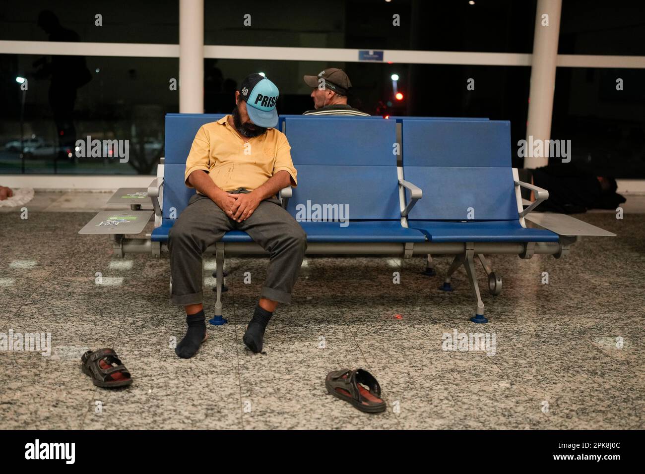 A homeless men sleep at the Jorge Newbery international airport ...