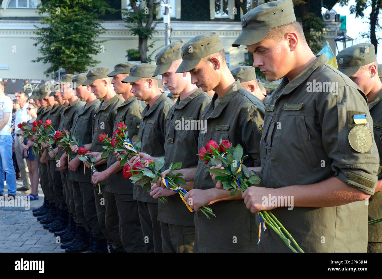 Ukrainian soldiers in military uniform standing in a rank and holding ...