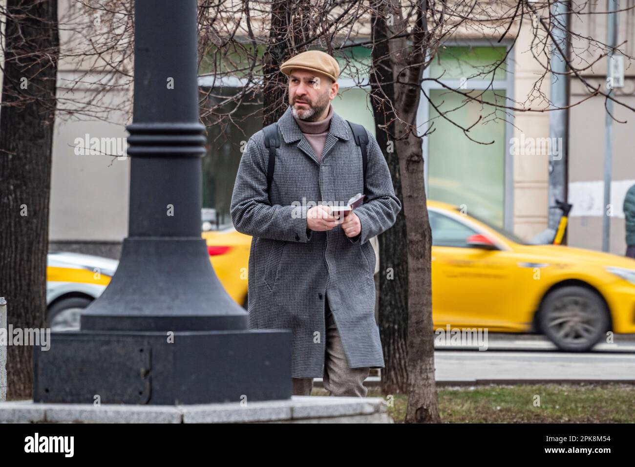 Russia, Moscow. A man walks in a city street in spring Stock Photo - Alamy