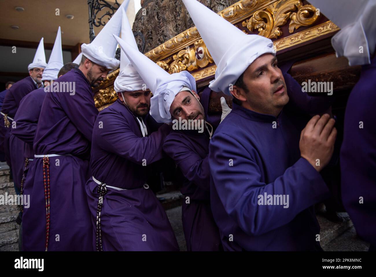 Several nazarenes carry the paso of Jesus Praying in the Garden during ...
