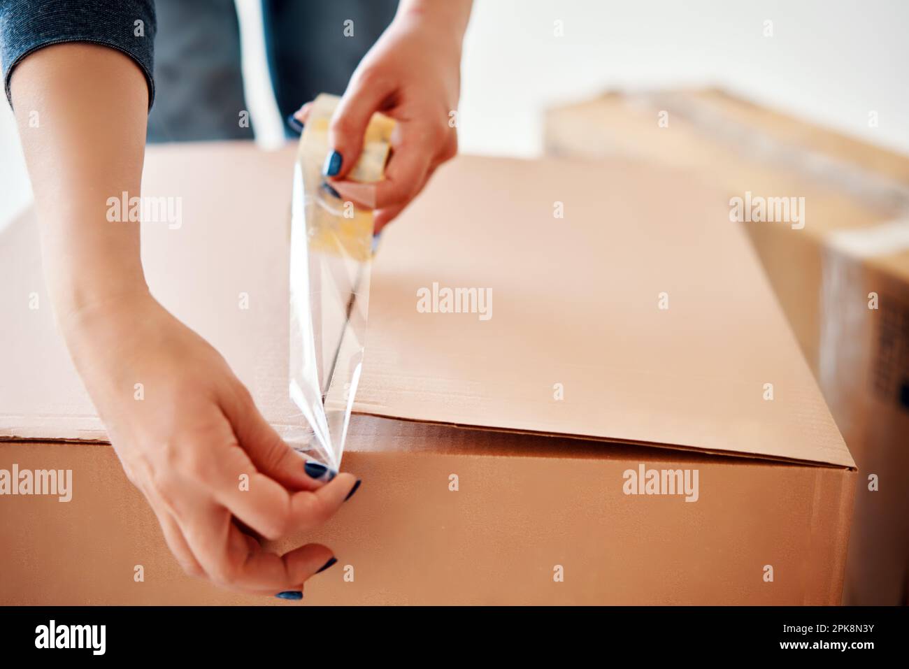 Woman packing cardboard box hi-res stock photography and images - Alamy