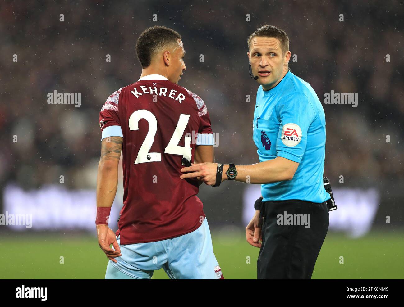 West Ham United's Thilo Kehrer (left) and referee Craig Pawson during ...