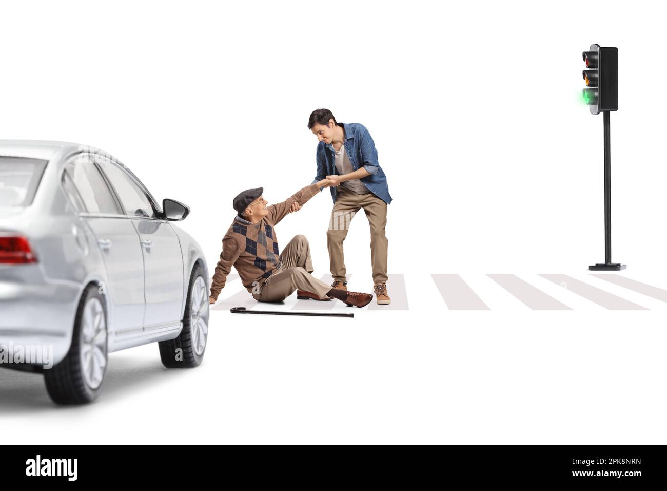 Young man helping an elderly man with a cane seated on pedestrian ...