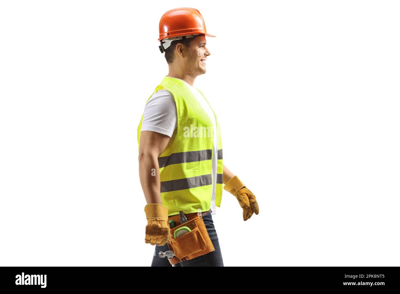 Profile shot of a construction worker with a helmet and tool belt ...