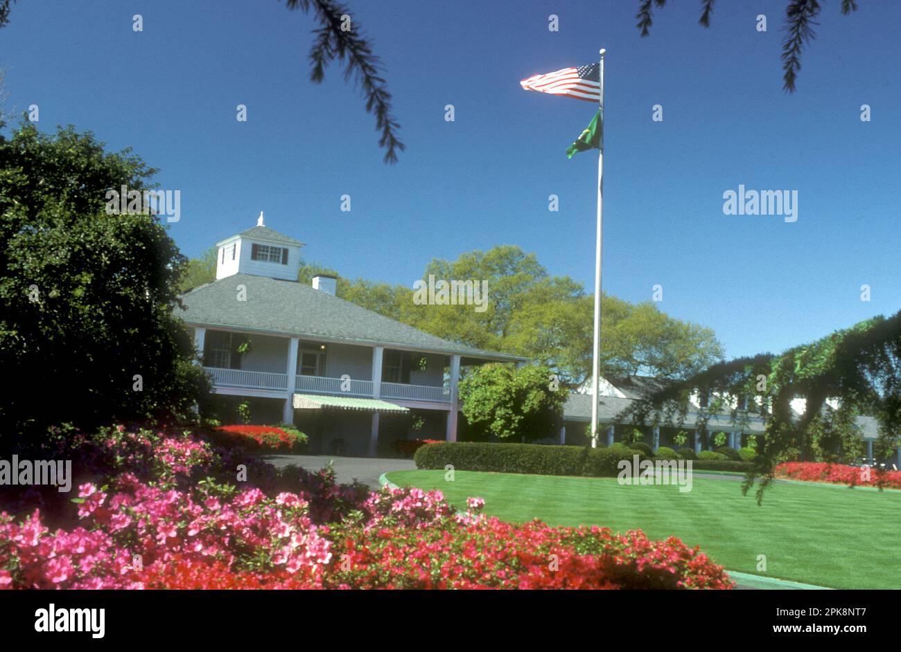Augusta Golf Course Clubhouse with American flag flying Stock Photo - Alamy