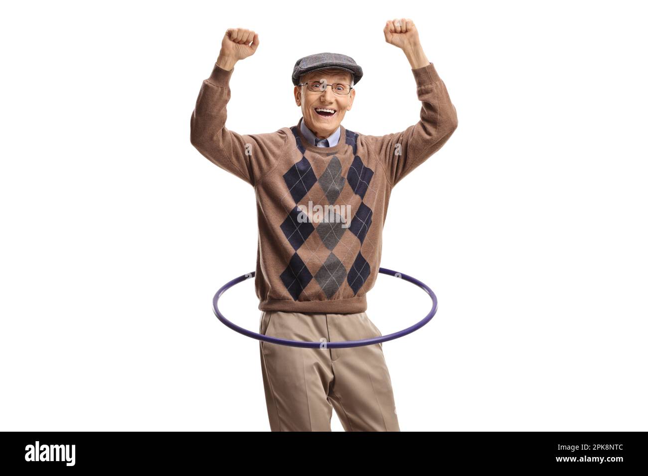 Happy elderly man spinning a hula hoop isolated on white background ...