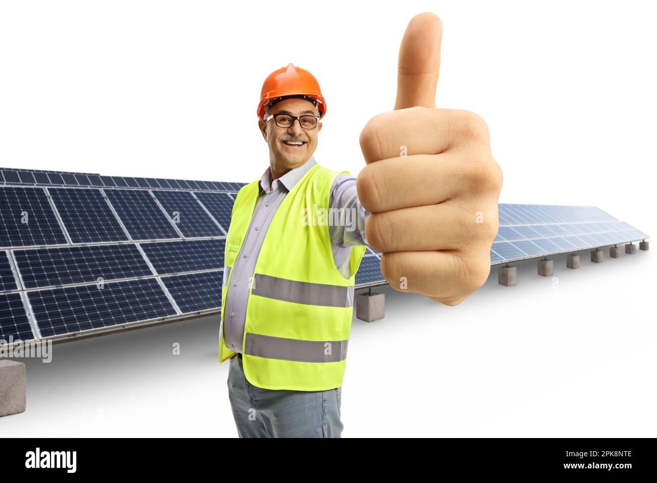 Cheerful mature male engineer showing thumbs up in front of a ...