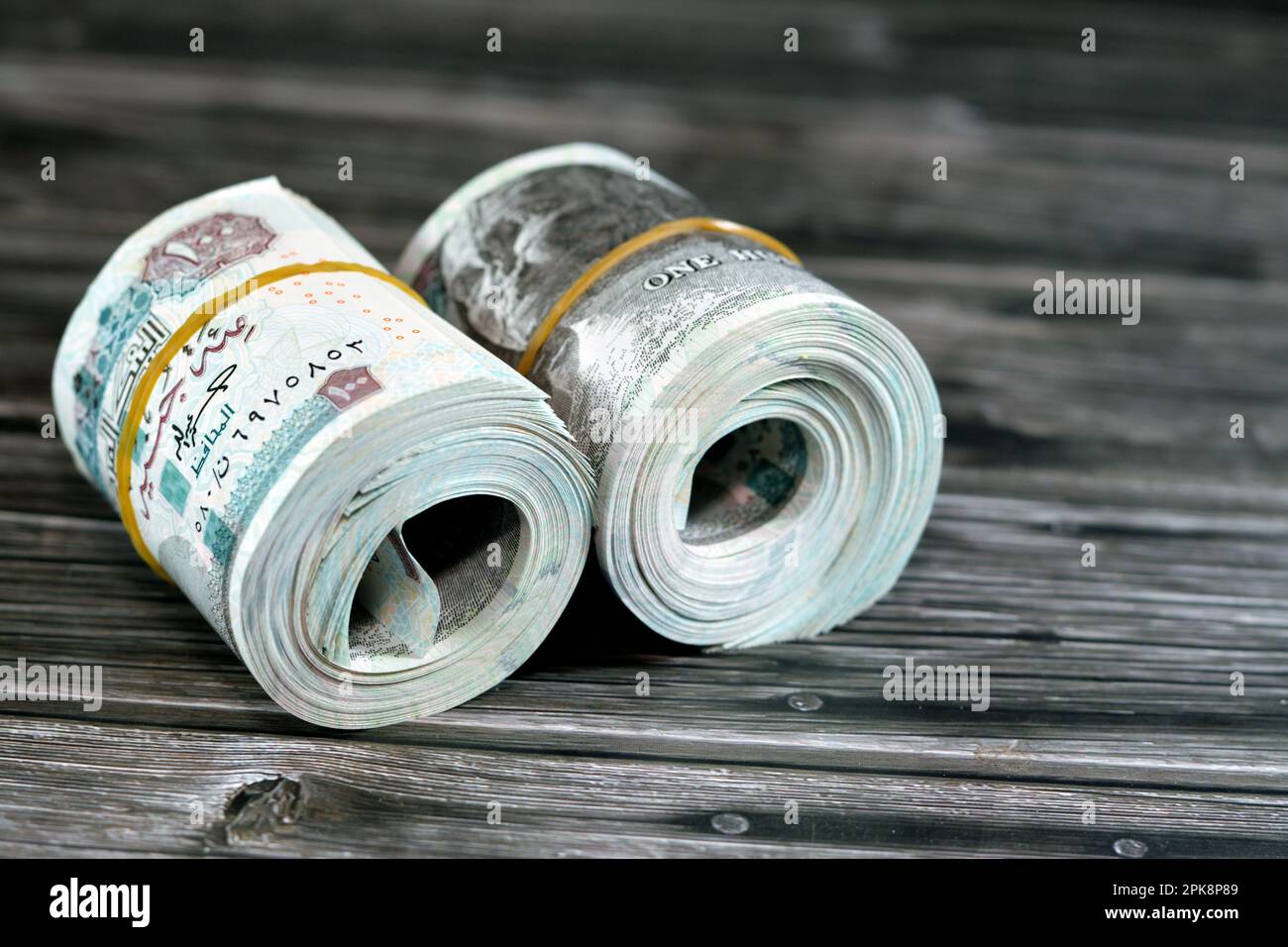 100 EGP LE one hundred Egyptian pounds cash money bills rolled up with ...