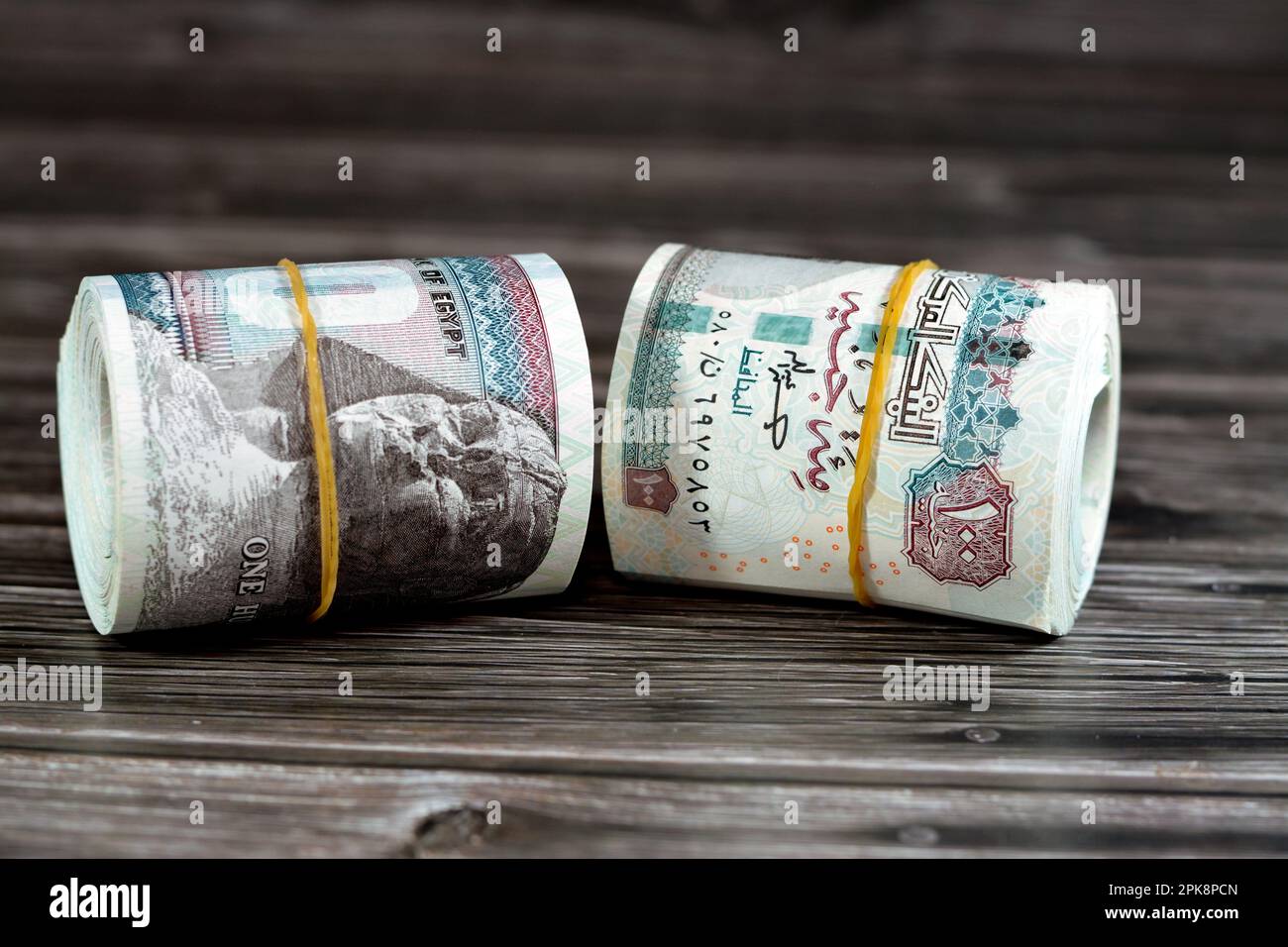 100 EGP LE one hundred Egyptian pounds cash money bills rolled up with ...