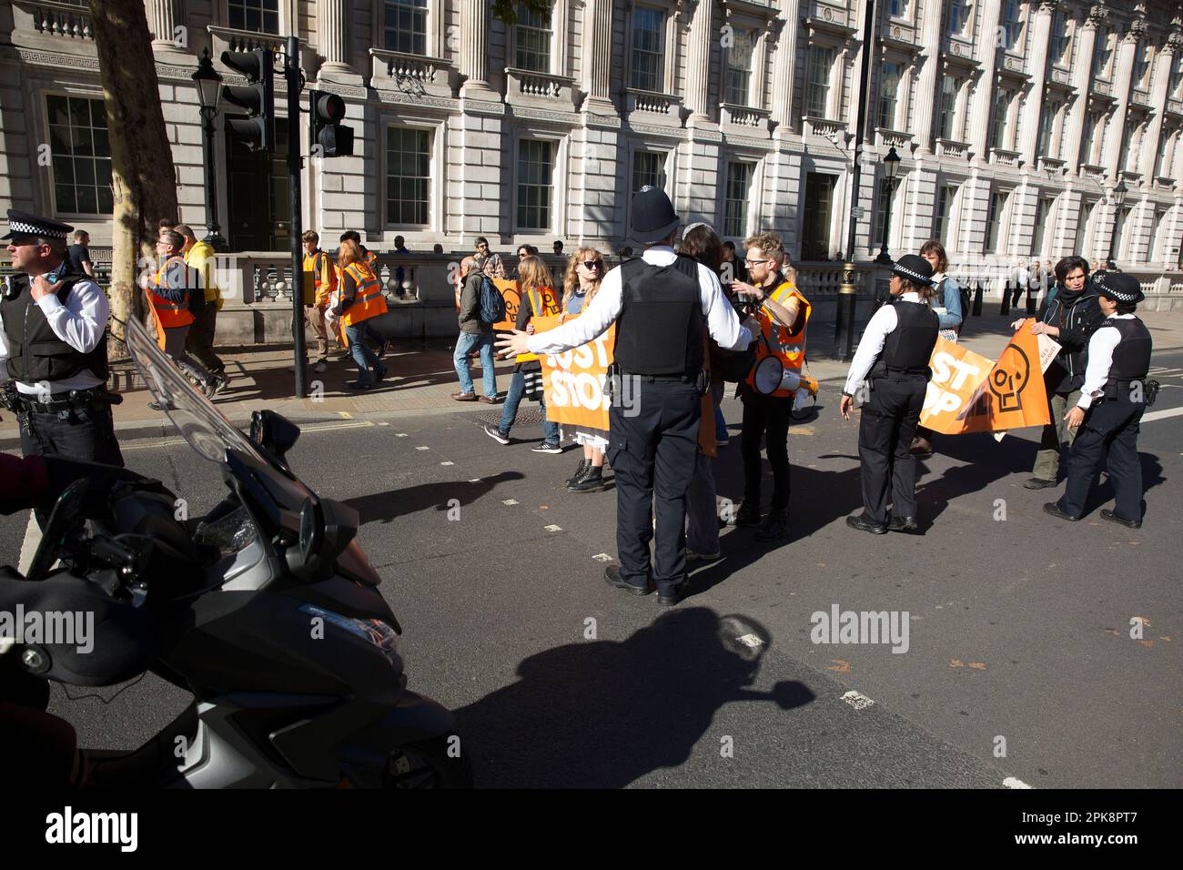 Just Stop Oil Activists Try To Hold A Banner In Front Of The Traffic