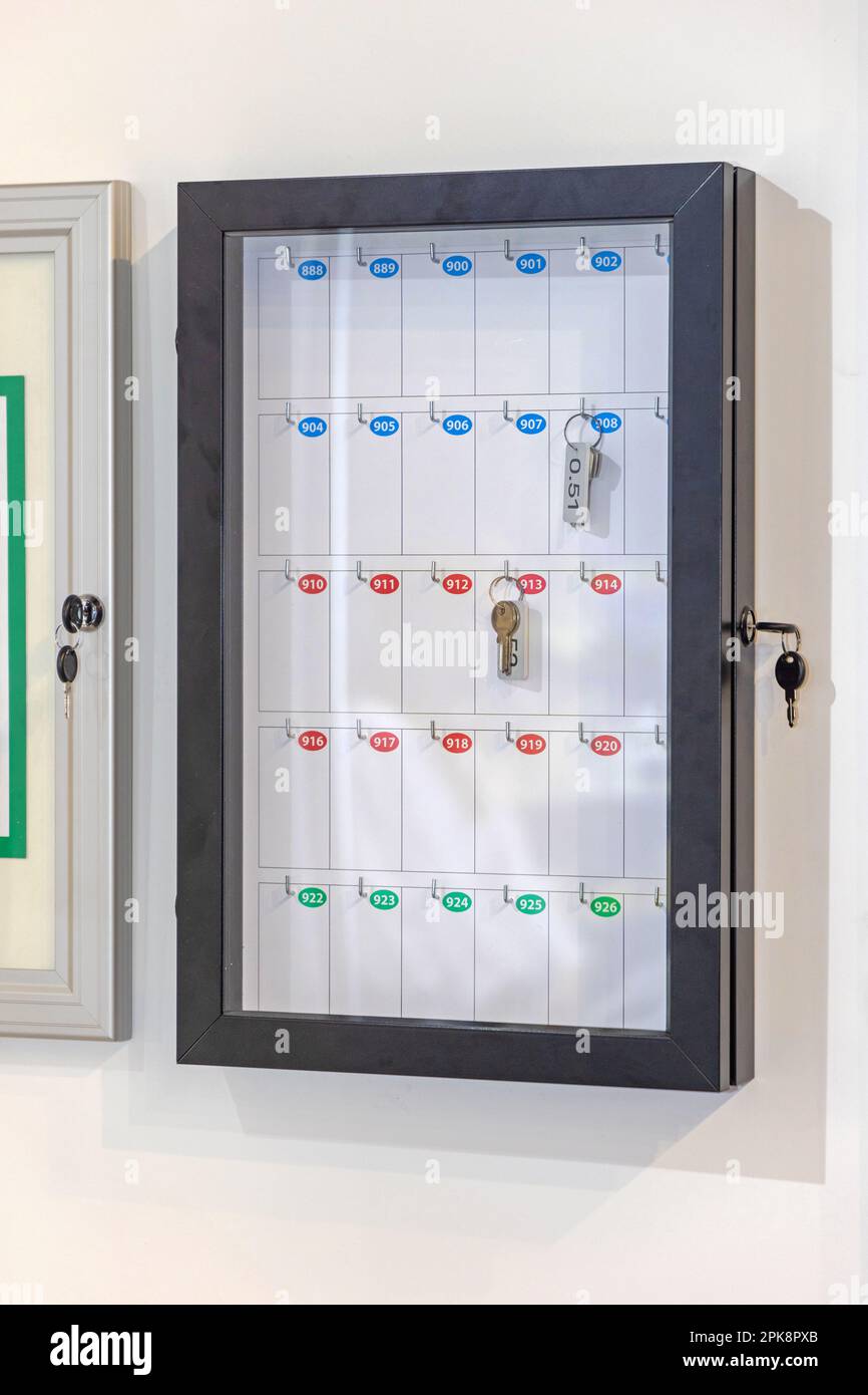 Keys Cabinet Glass Door With Lock at Wall Stock Photo - Alamy