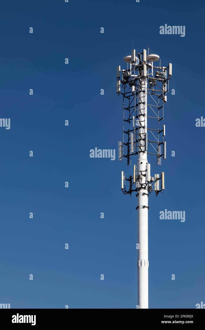 Cell phone tower in field Stock Photo - Alamy