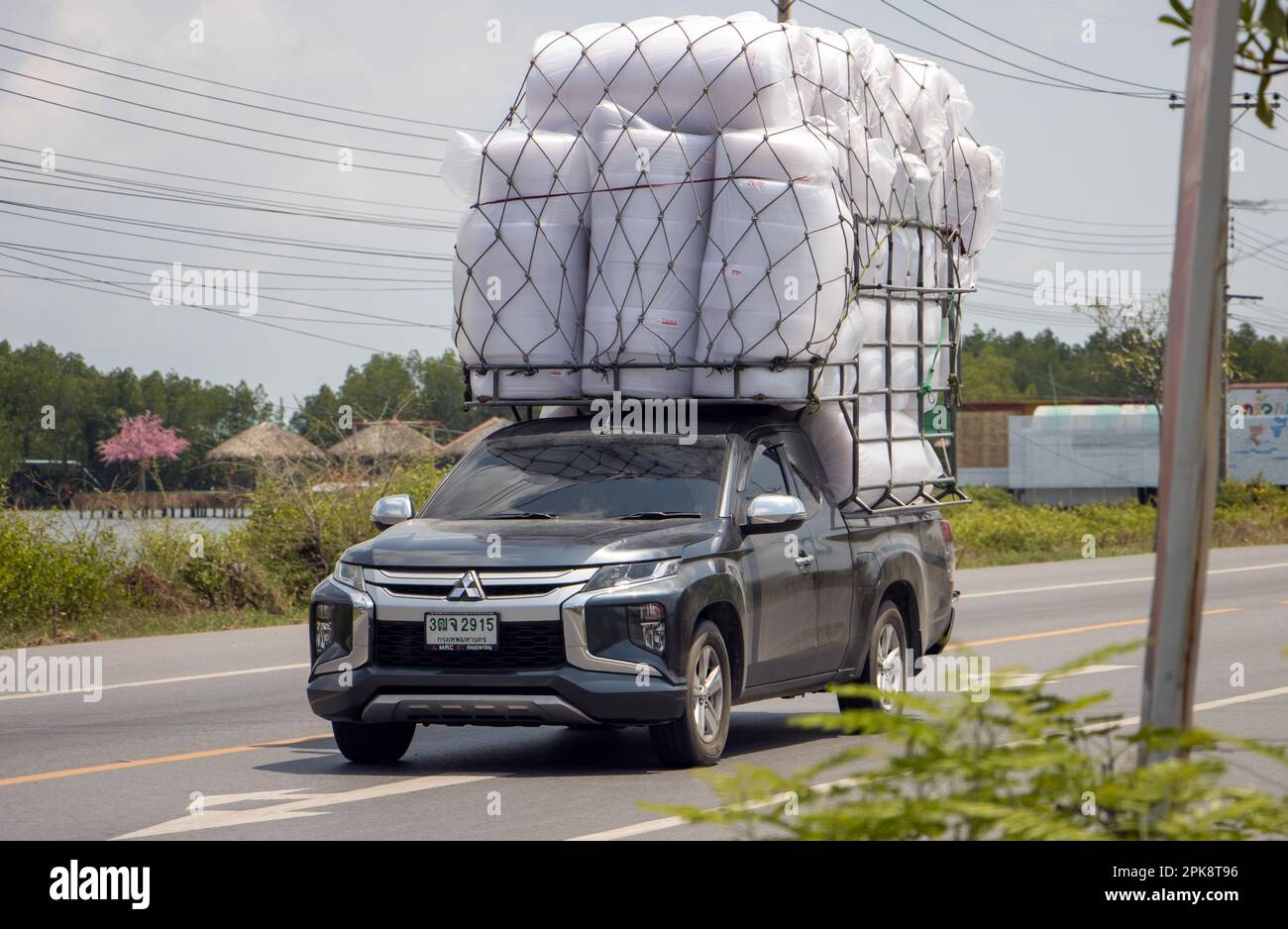 BANGKOK, THAILAND, MAR 24 2023, A pick up car loaded with many sacks of ...