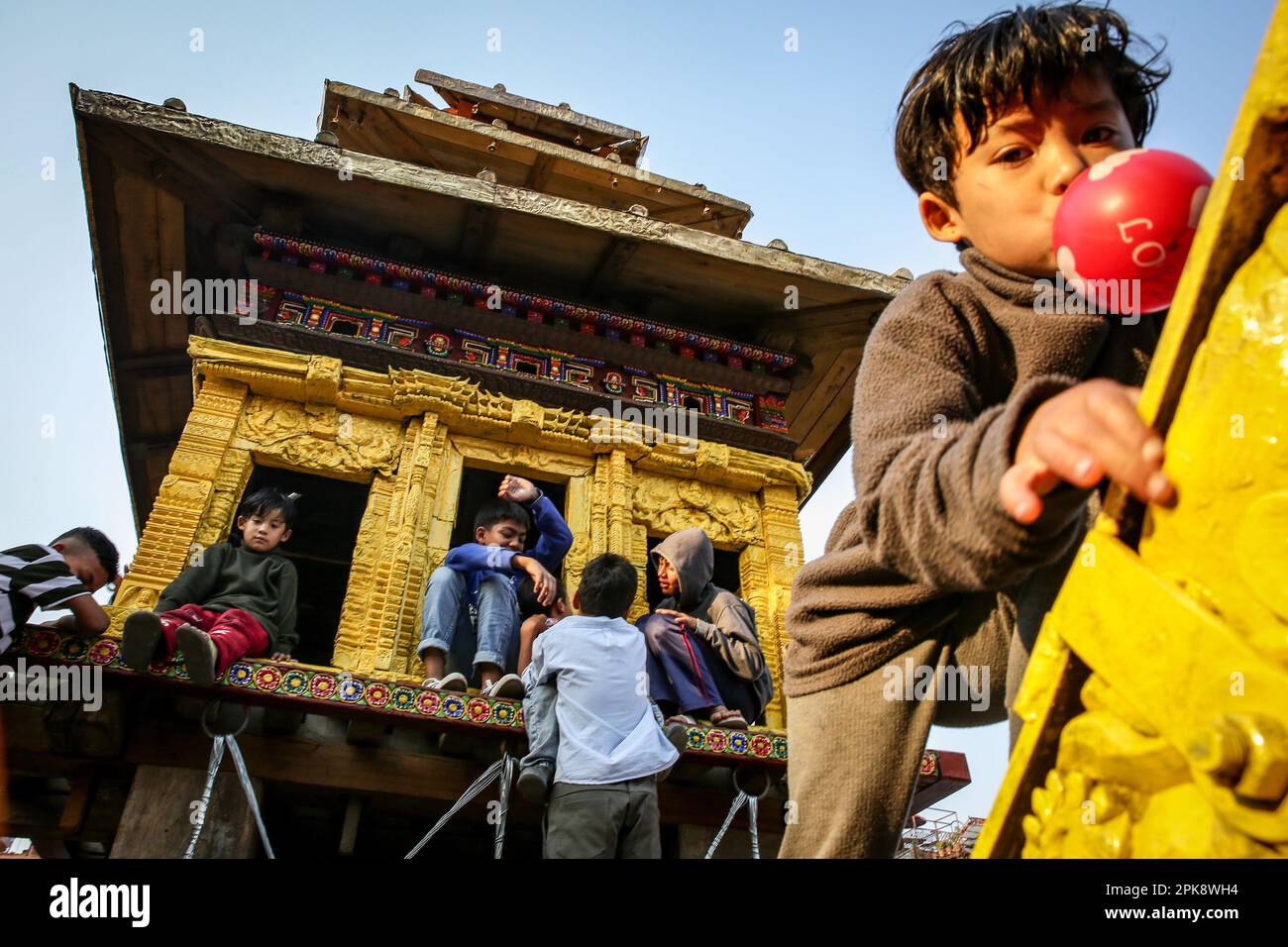 Nepal. 6th Apr, 2023. Children play in the pagoda style chariot which ...