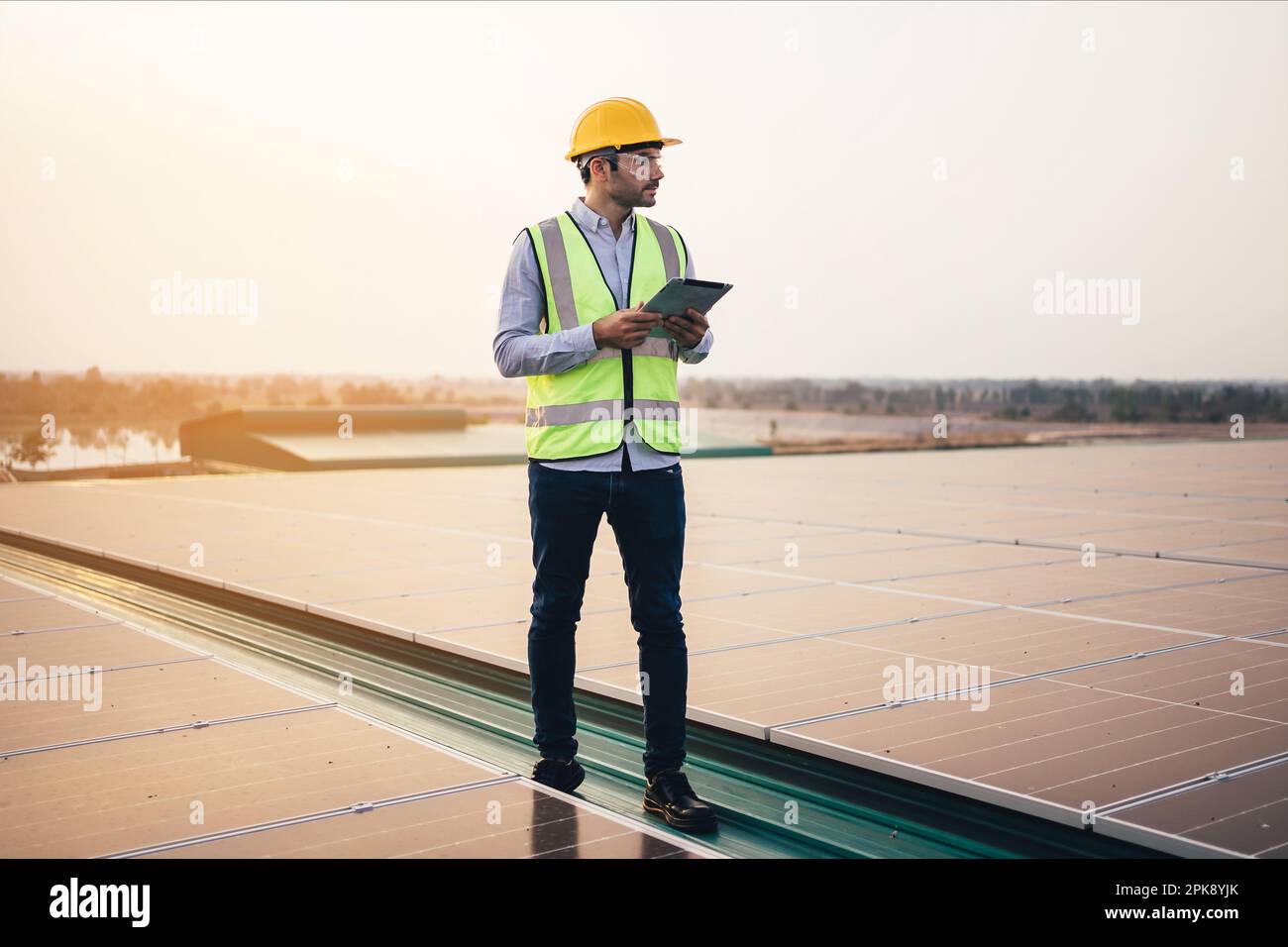Engineer foreman using tablet checking at industrial solar power plant ...