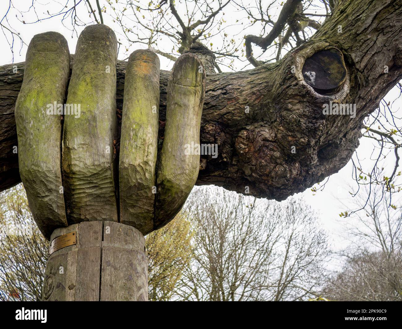 BIDEFORD, DEVON, UK - APRIL 1ST 2023: Carved hand supporting ancient ...