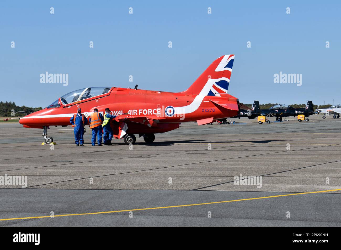 Red Arrow on the runway Stock Photo - Alamy