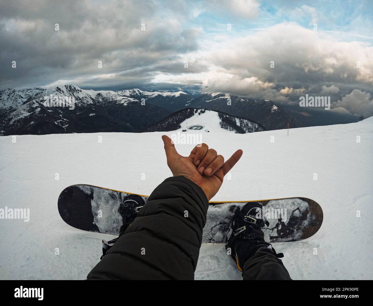 Snowboarder, detail, snow, sit, mountain view, gesture, shaka Stock ...