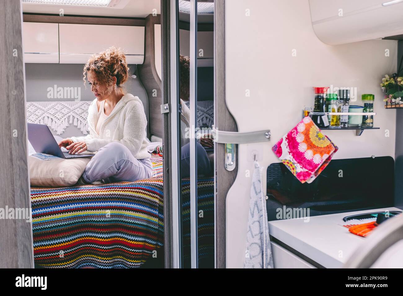 Camper, wife, bed, laptop, work Stock Photo - Alamy