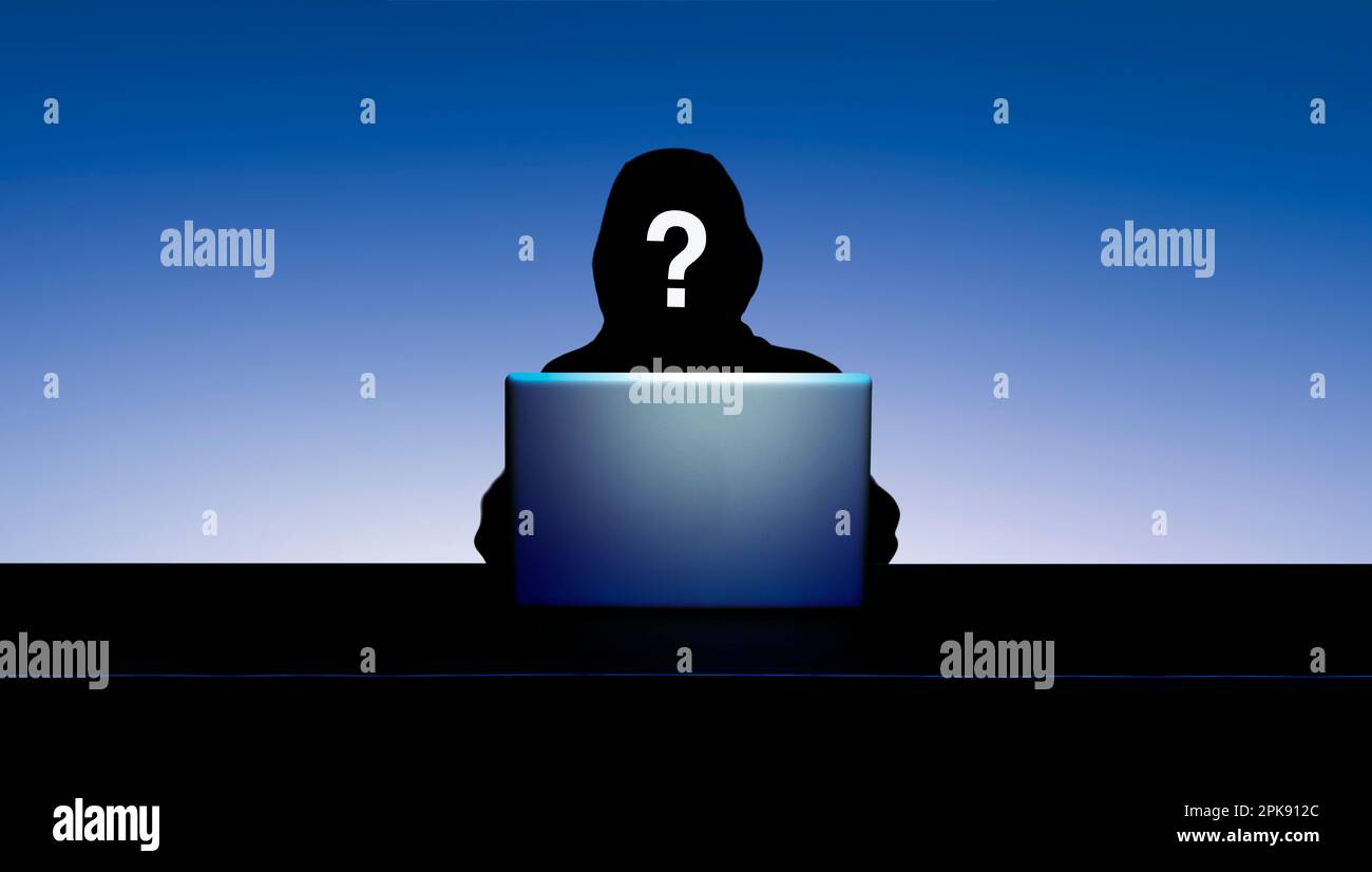 Dark person with hood silhouetted against open laptop and digital ...