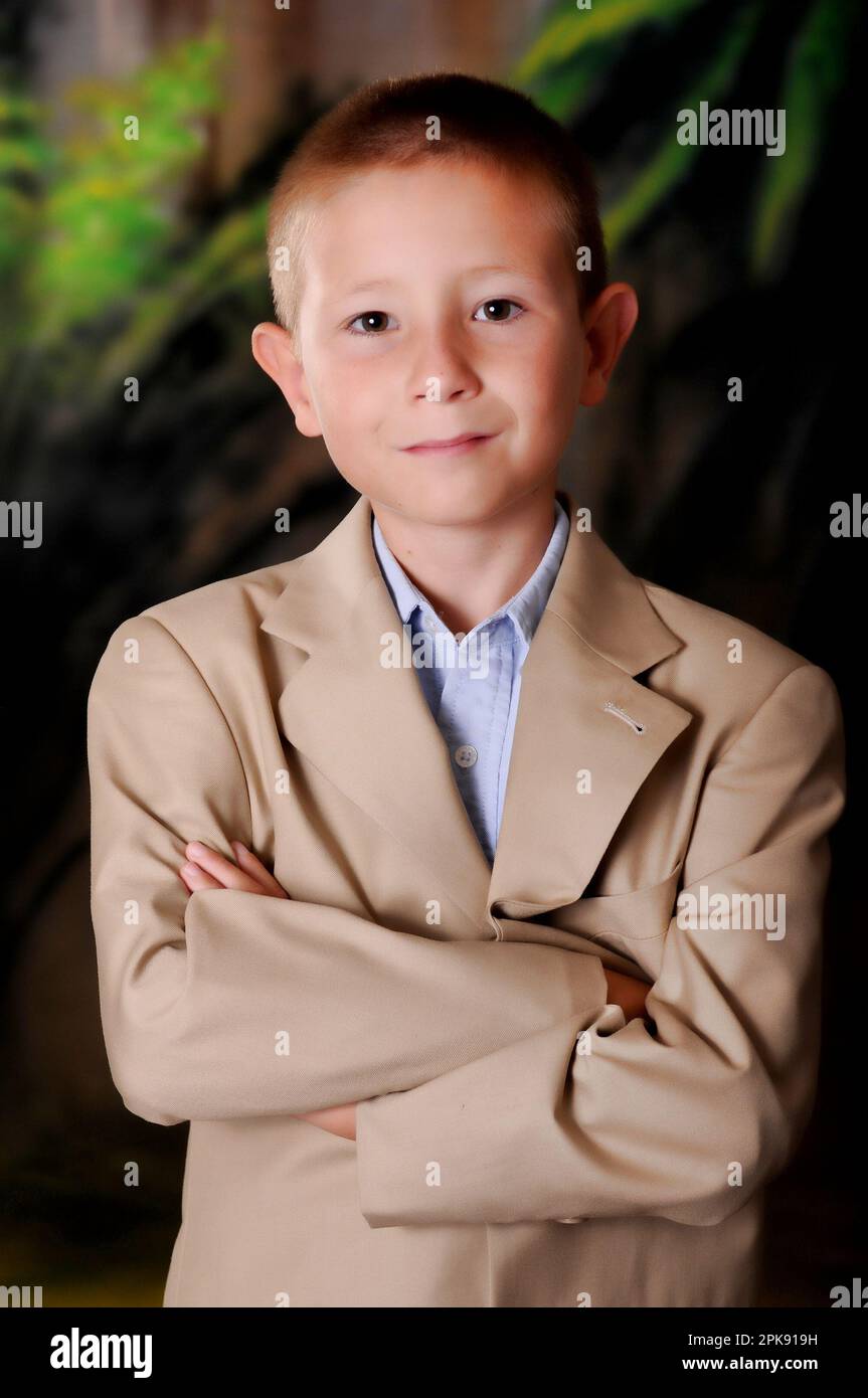 Young boy businessman dressed formally wearing a suit Stock Photo - Alamy