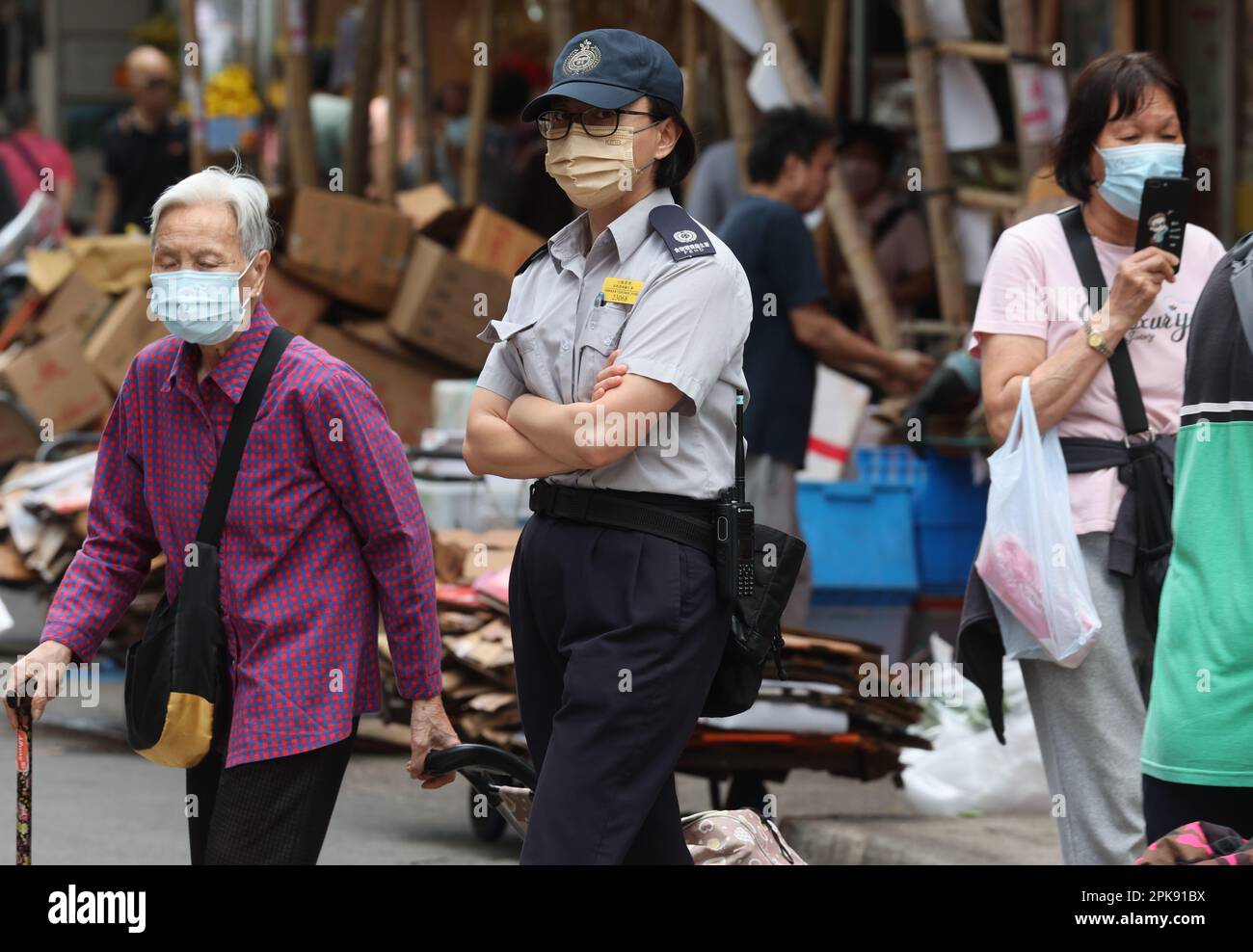 A staff member of the Food and Environmental Hygiene Department patrols ...