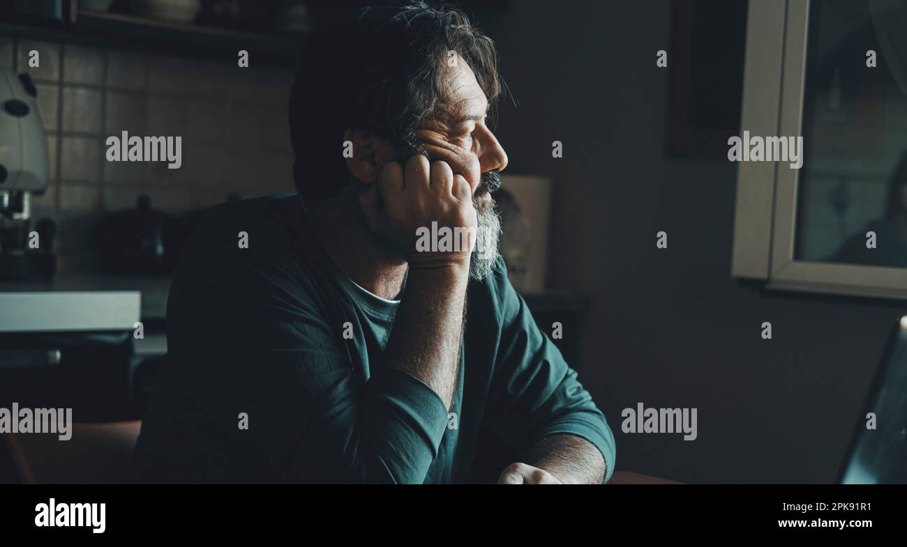 Man, Thoughtful, Table, Sit, Head, prop up Stock Photo - Alamy