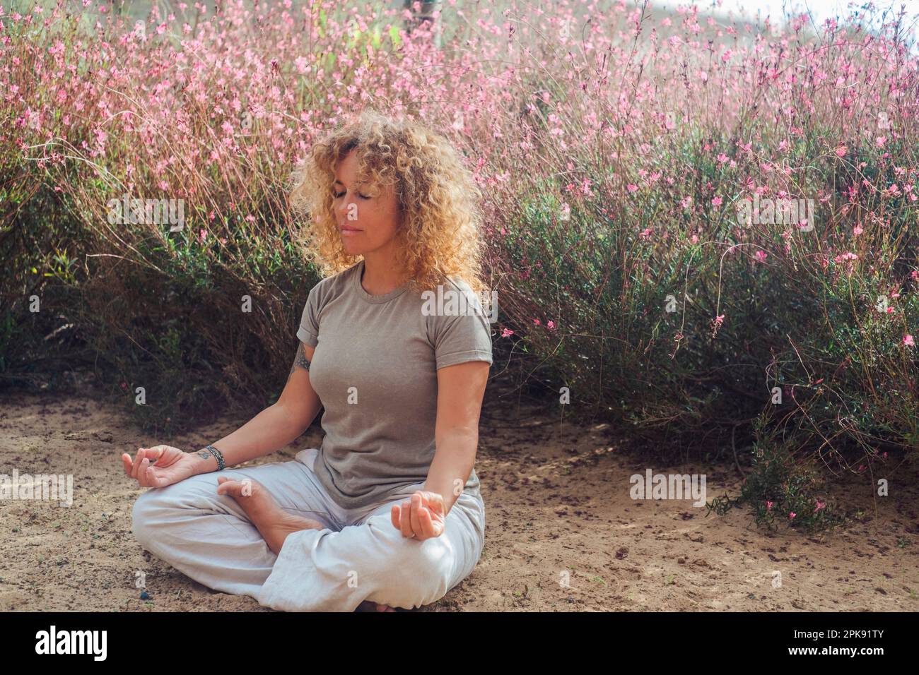 Mindfulness exercise and yoga lotus posture, woman, sitting, flowers ...