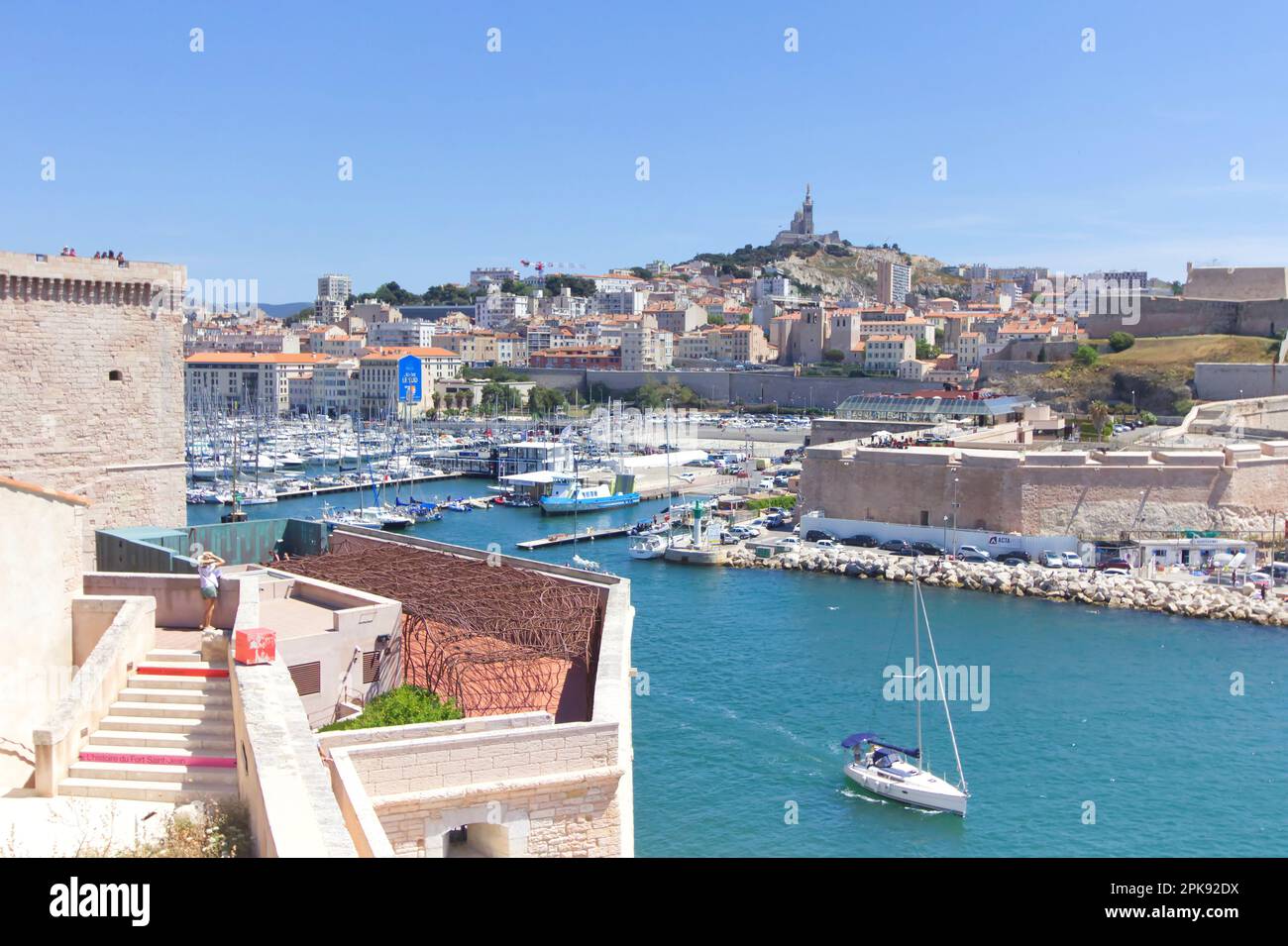 Scenic view over the harbor area of Marseille with church Notre-Dame de ...