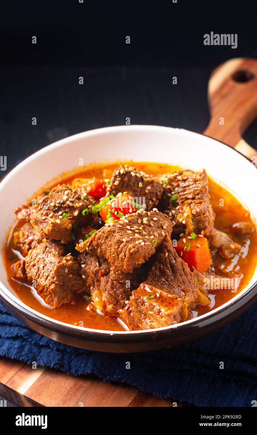 Food concept Korean spicy Beef stew on black background with copy space ...