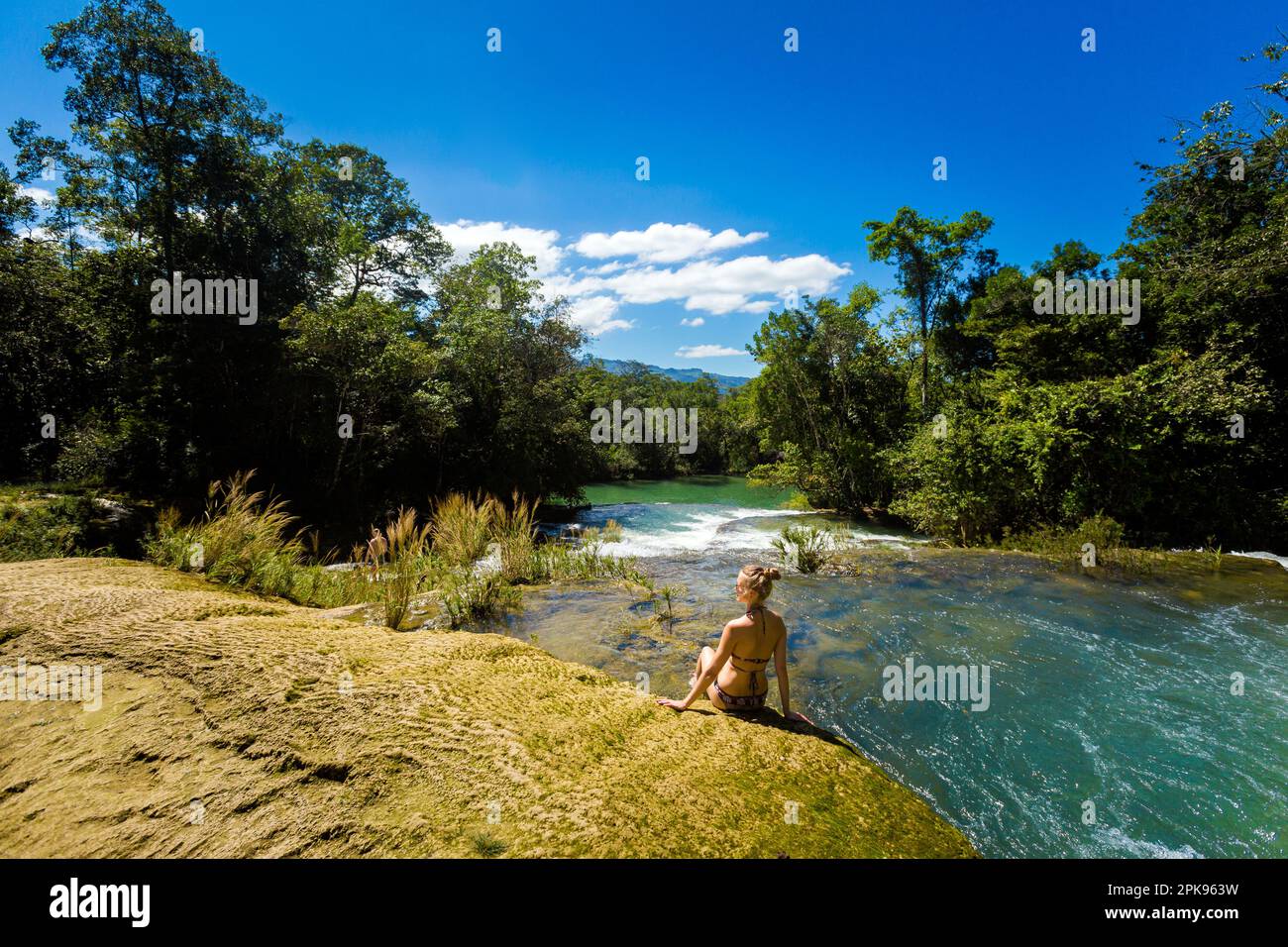 Young pretty woman relaxing by the water in Roberto Barrios cascadas ...