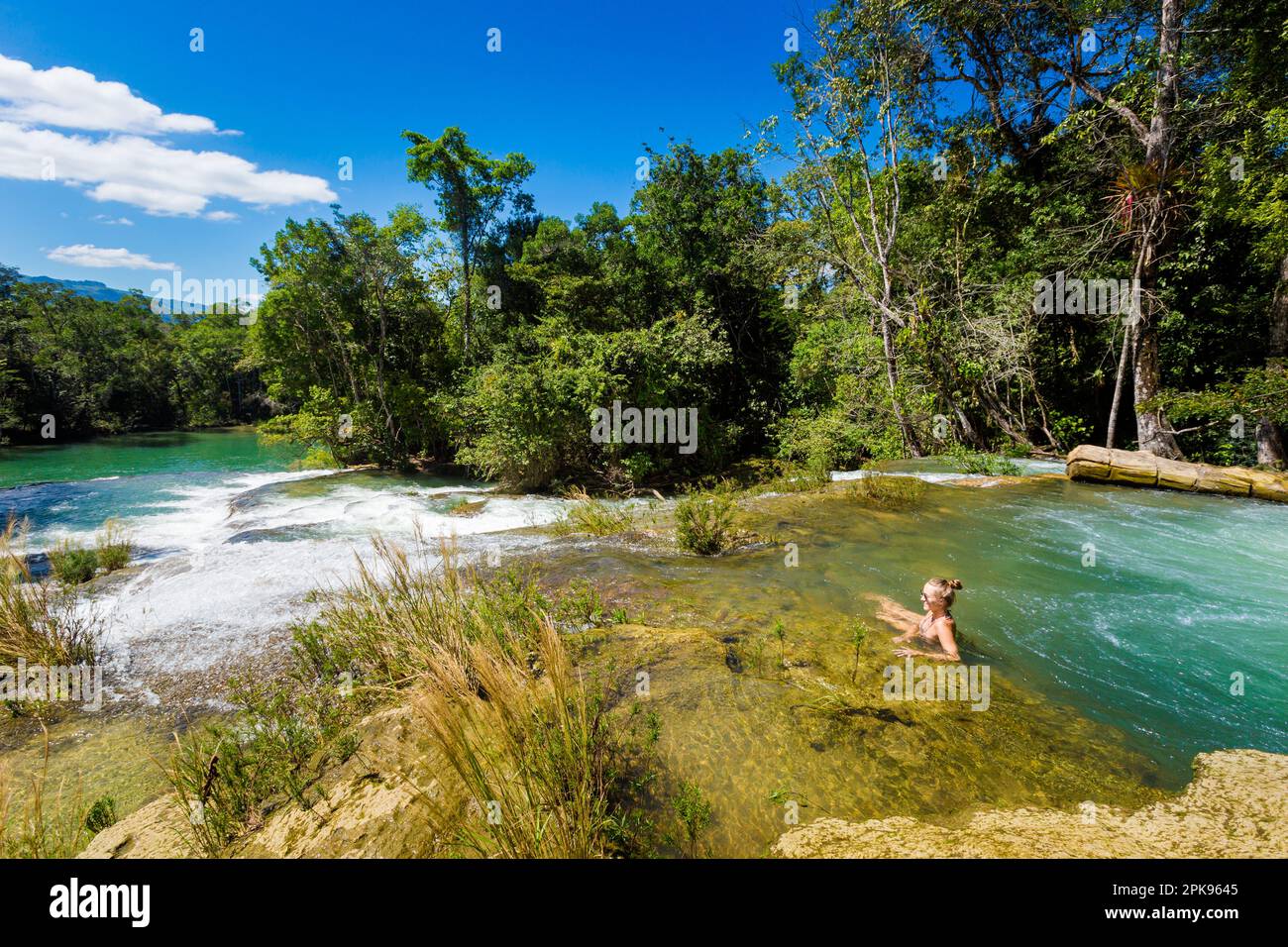 Young pretty woman relaxing by the water in Roberto Barrios cascadas ...