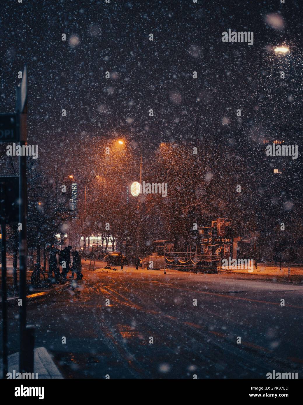 Urban winter night scene depicting a snowstorm in the streets of ...