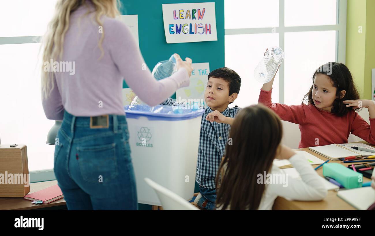 Woman and group of kids throwing plastic bottle on paper bin recycling ...