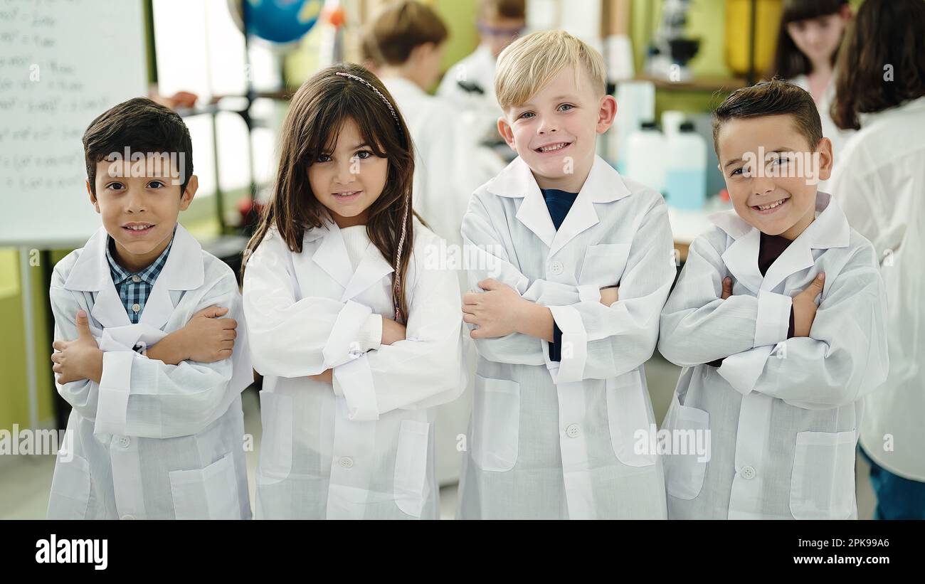 Group of kids scientists students smiling confident standing with arms ...