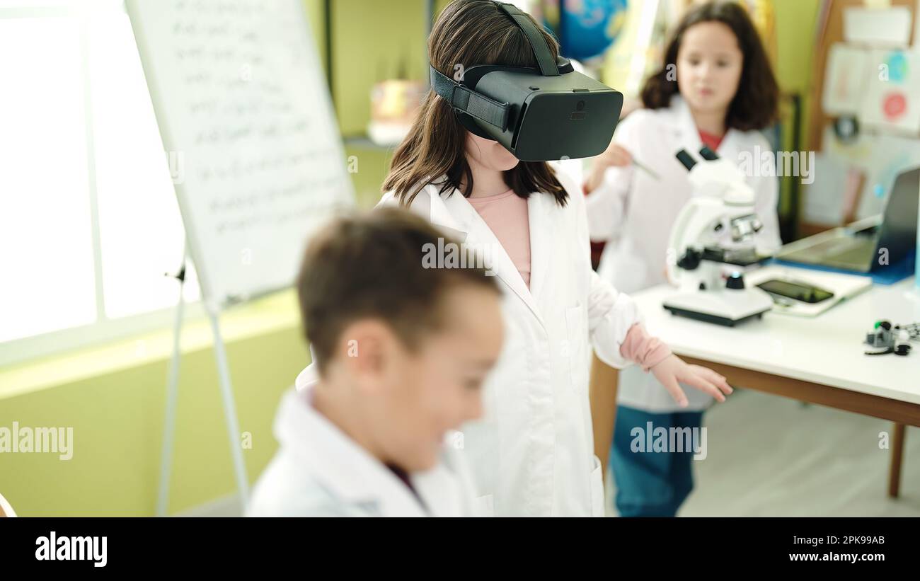 Group of kids students using virtual reality glasses at laboratory ...