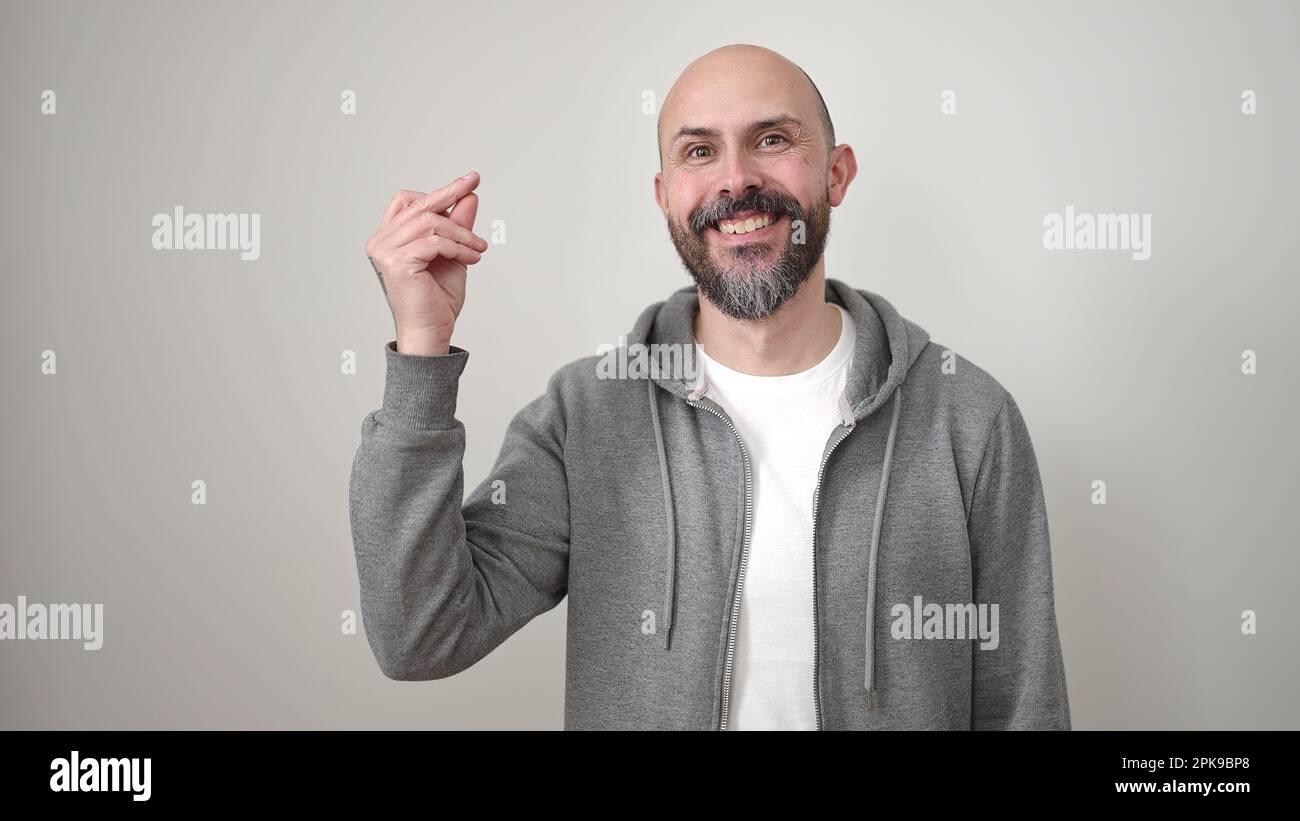 Young bald man smiling confident standing over isolated white ...