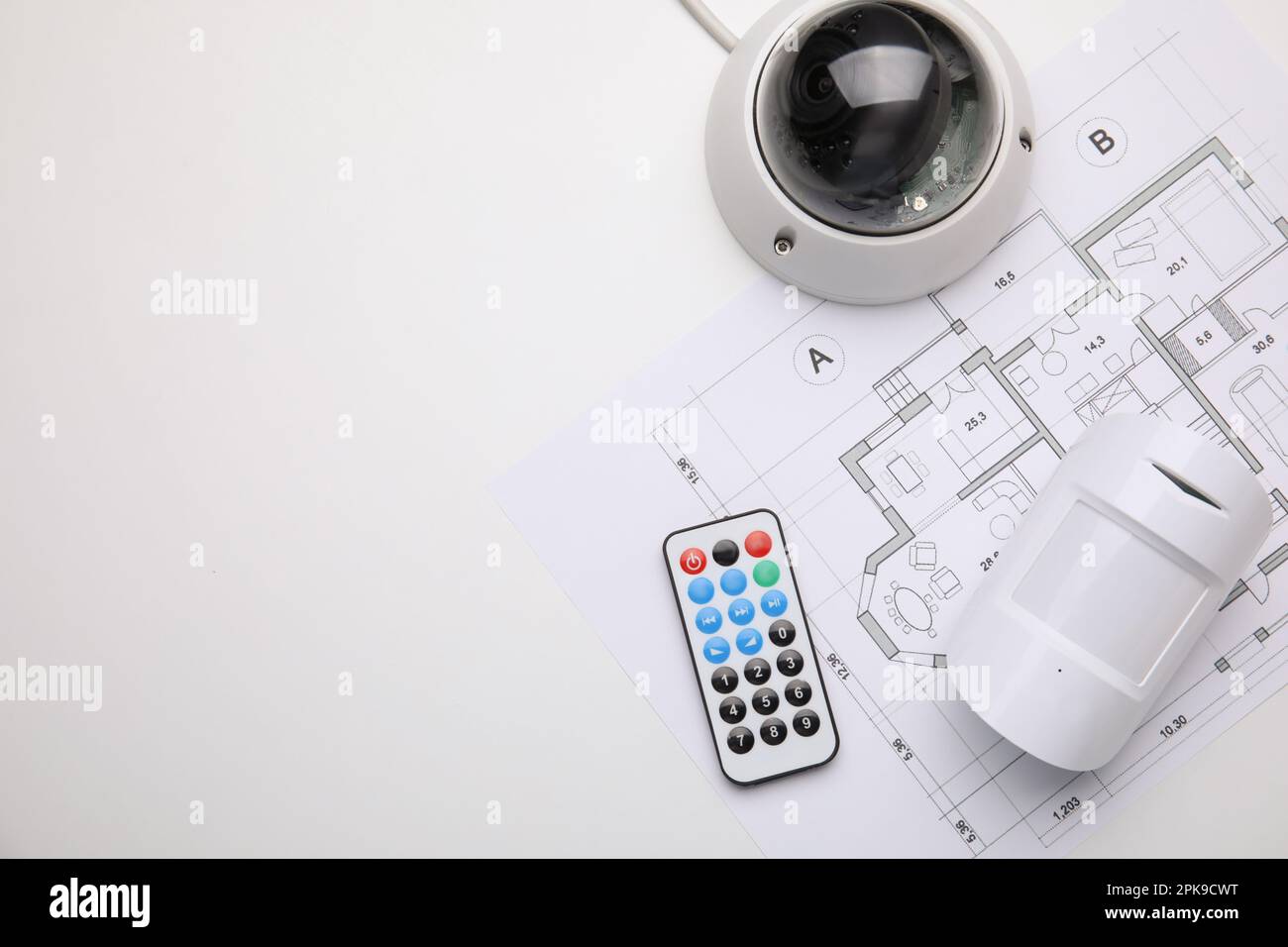 CCTV camera, remote control, movement detector and building plan on ...