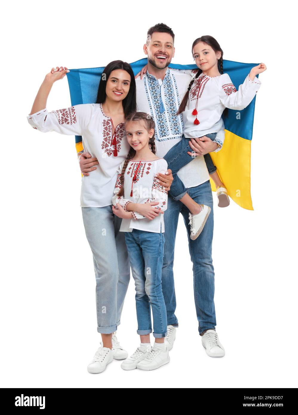 Happy family in national clothes with flag of Ukraine on white ...