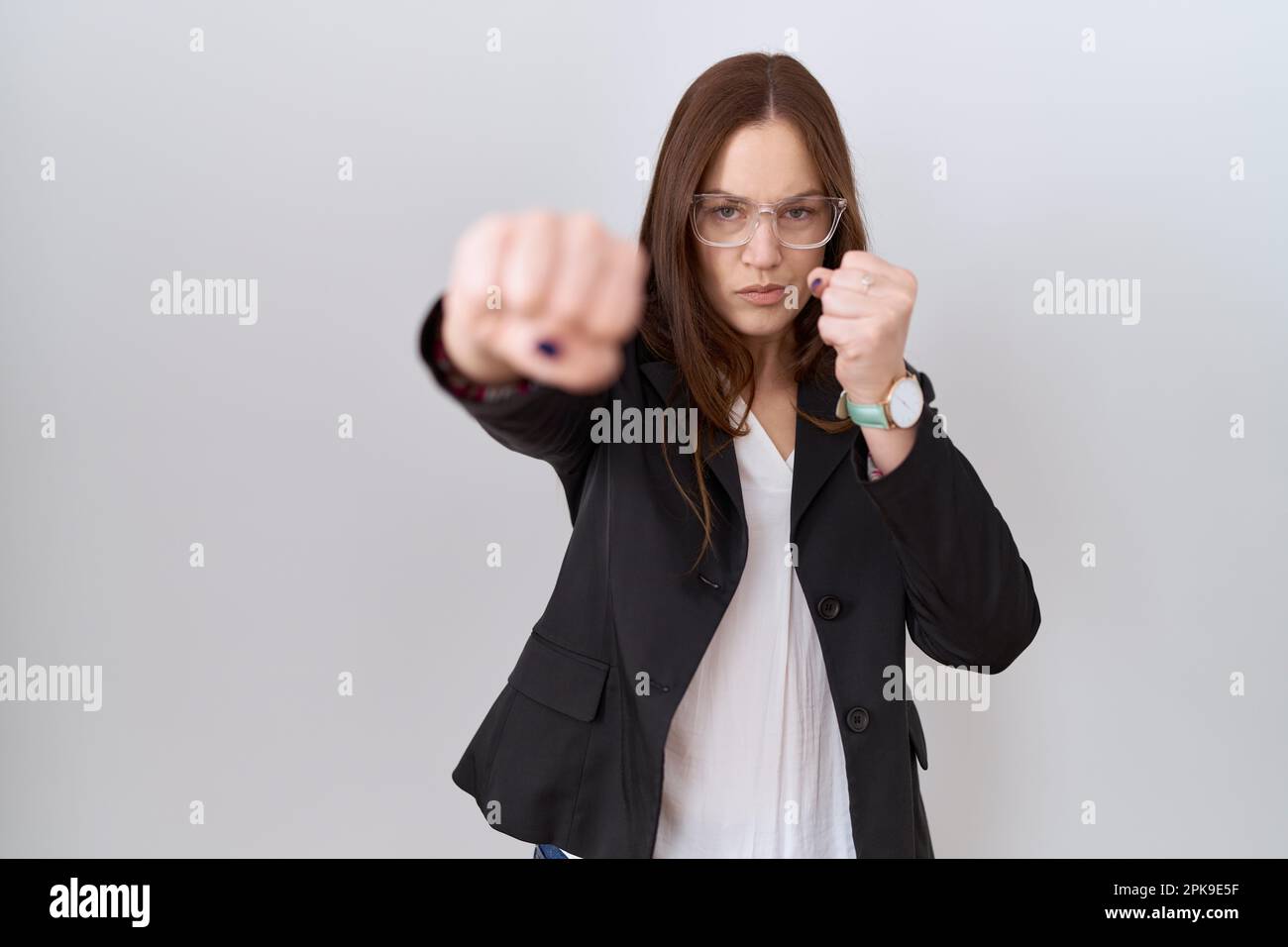 Woman wearing glasses fist punching hi-res stock photography and images ...