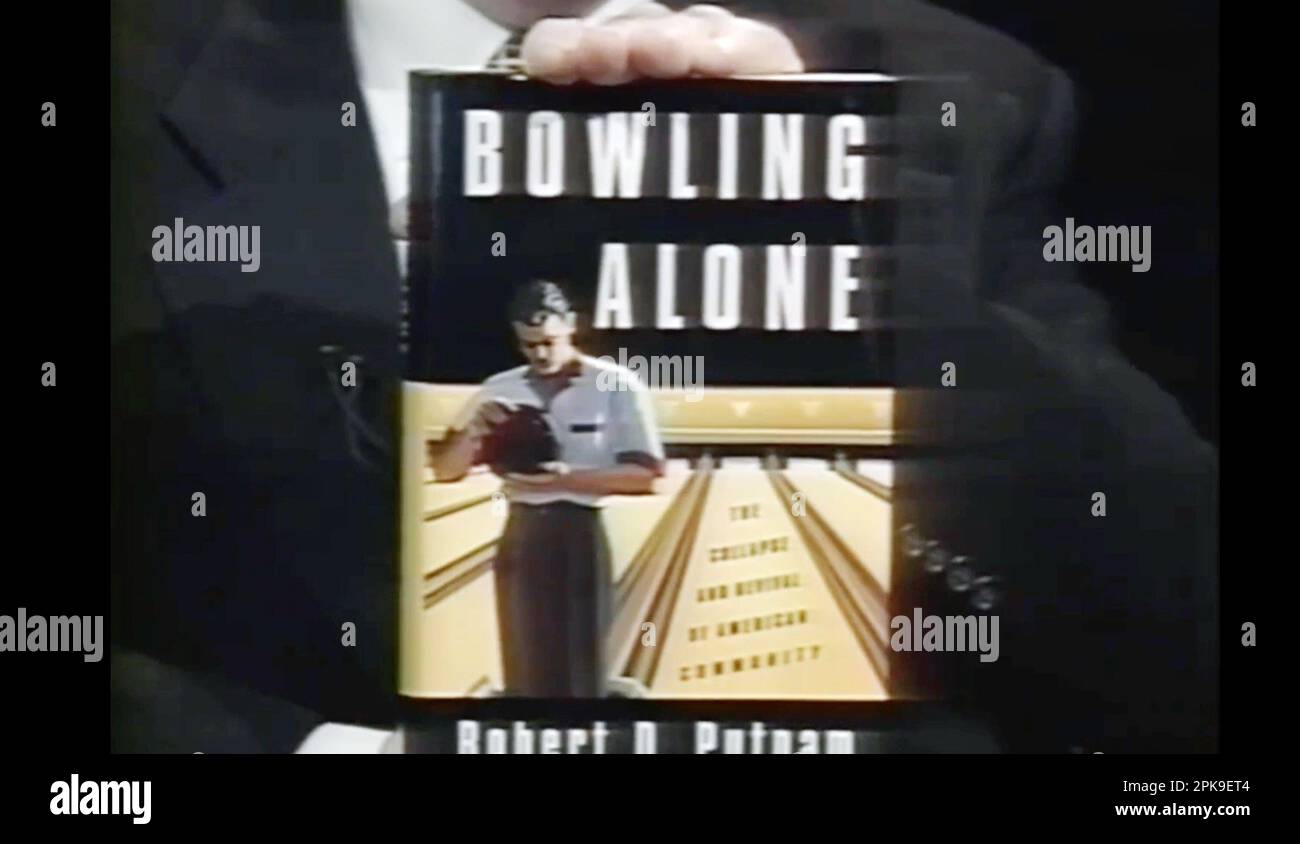 JOIN OR DIE,Robert Putnam, holding his book, 'Bowling Alone' in ...