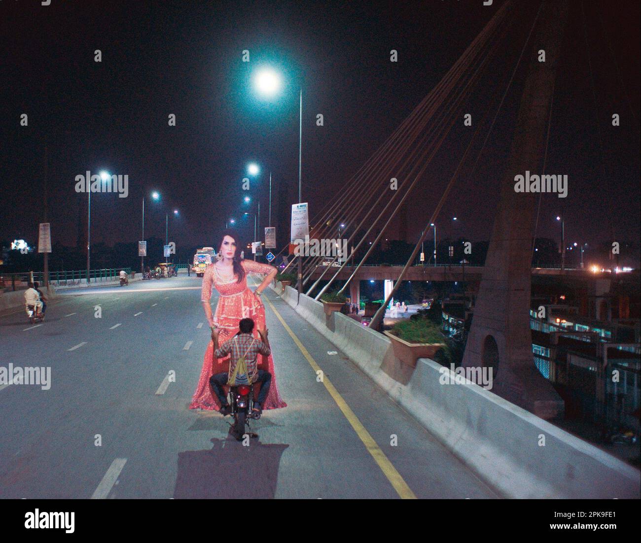 JOYLAND, Ali Junejo, holding display of Alina Khan, 2022 ...