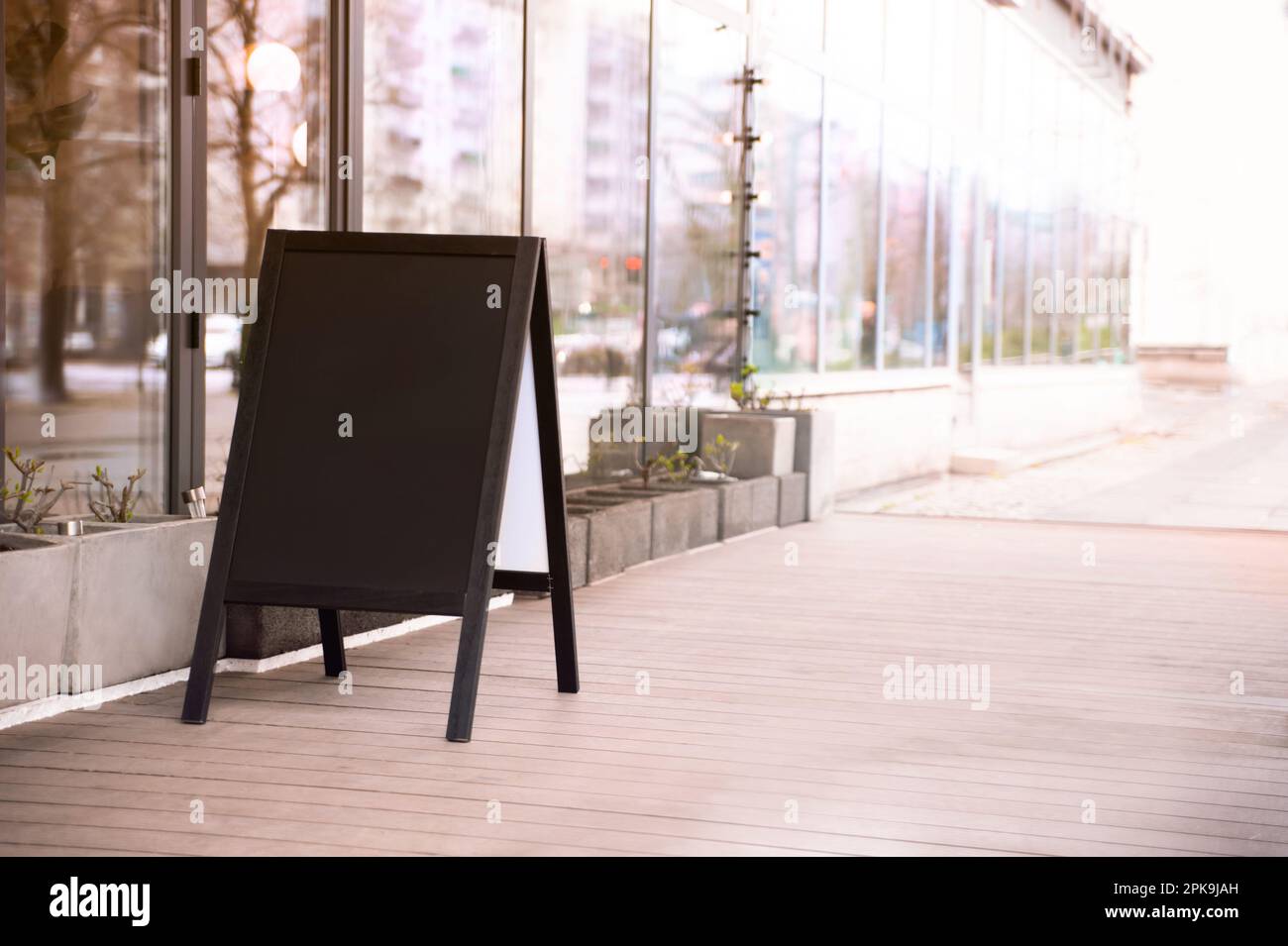 Empty A-board near building outdoors. Mockup for design Stock Photo - Alamy