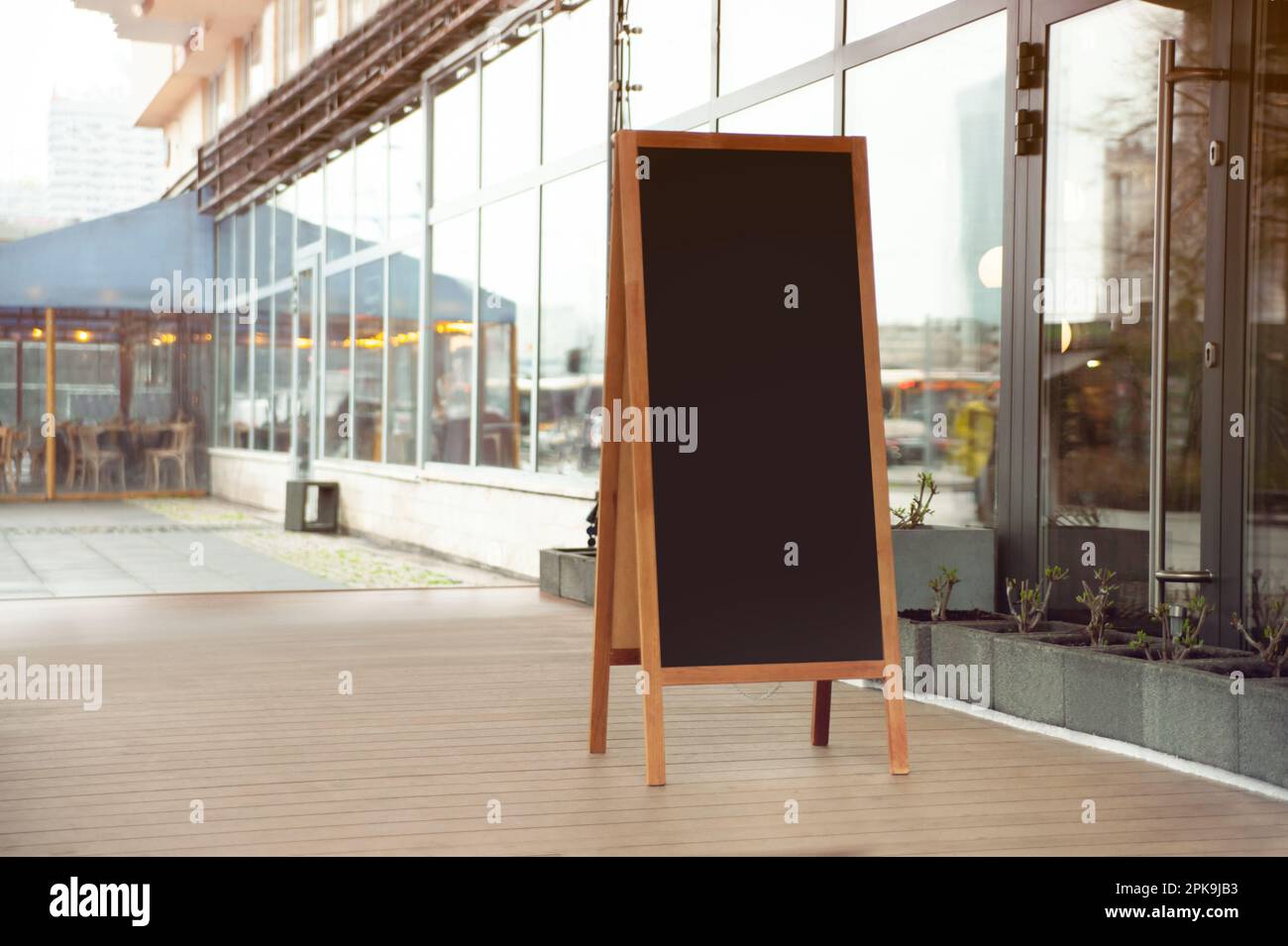 Empty A-board near building outdoors. Mockup for design Stock Photo - Alamy