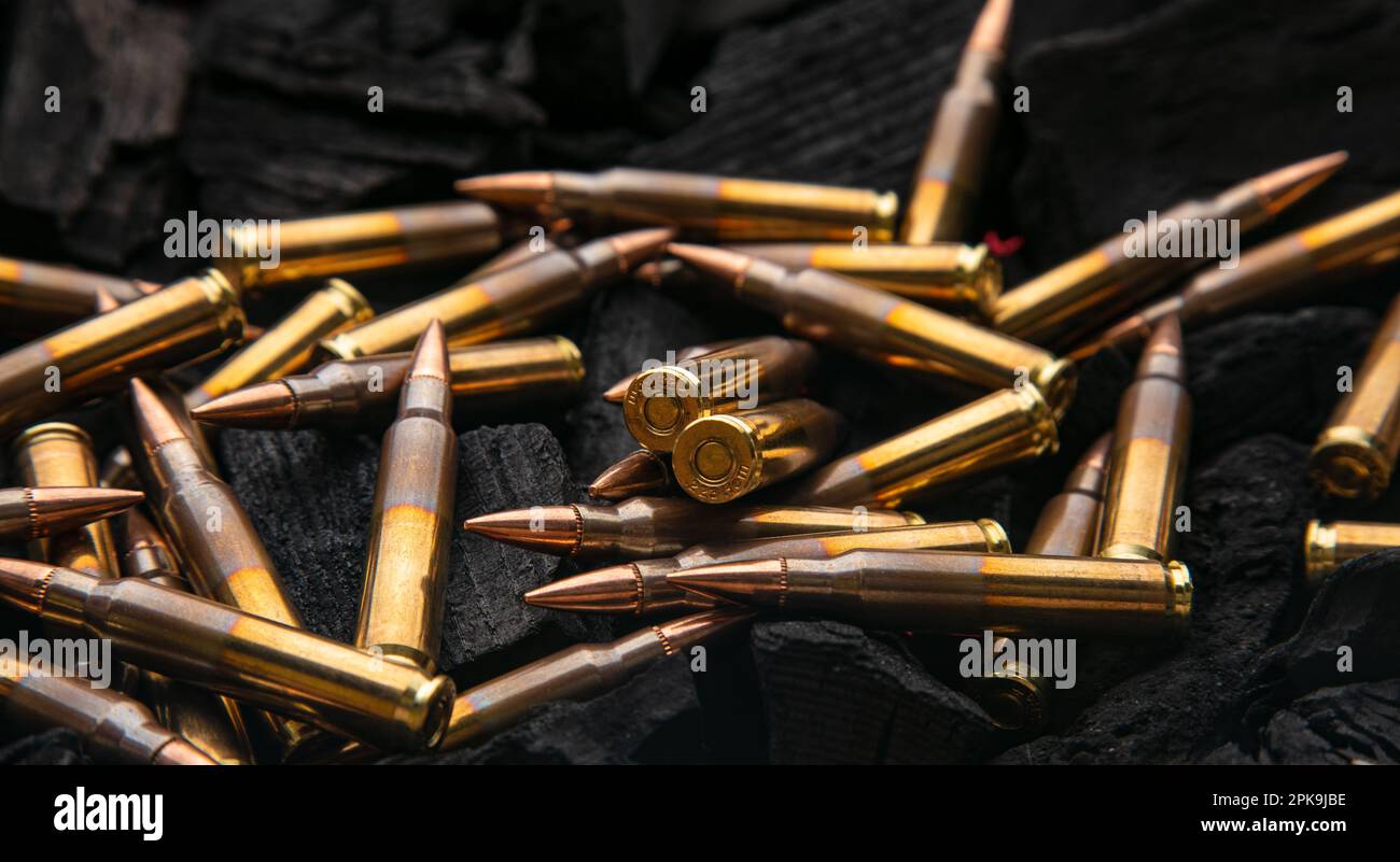Cartridges for automatic carbine caliber .223 on charcoal. Ammunition ...