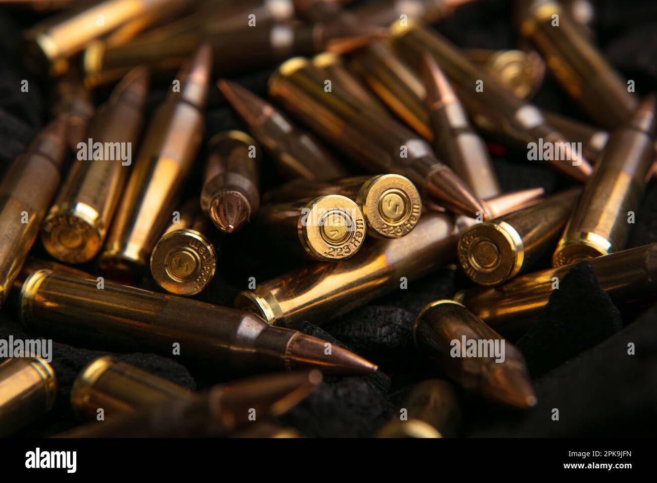 Cartridges for automatic carbine caliber .223 on charcoal. Ammunition ...