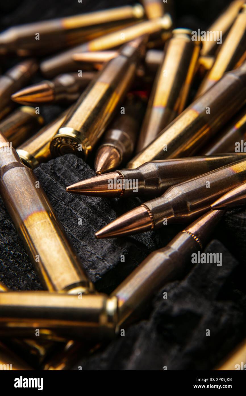 Cartridges for automatic carbine caliber .223 on charcoal. Ammunition ...