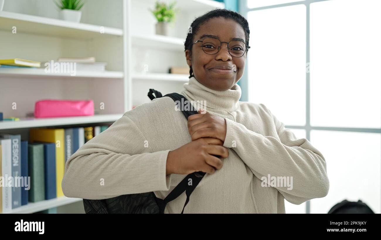 African american woman student smiling confident wearing backpack at ...